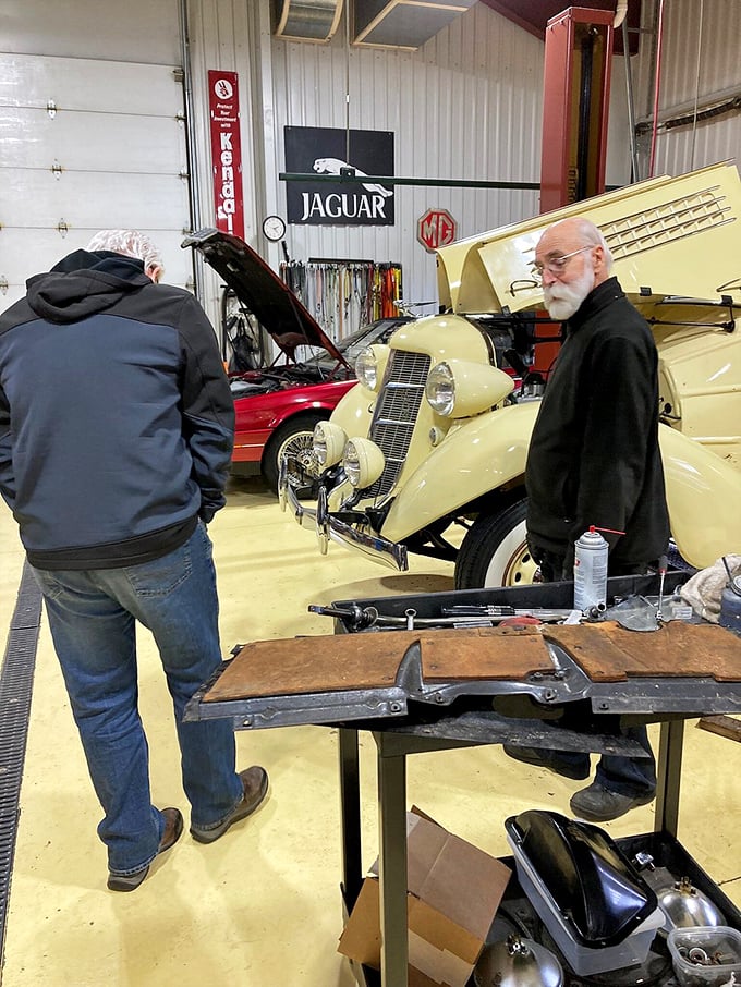 In the workshop, automotive history gets the white-glove treatment. This cream-colored classic isn't just restored—it's reborn through passionate craftsmanship.