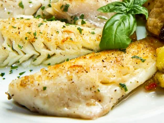 Delicate fish prepared with surgical precision, proving that Alexander's mastery extends well beyond the realm of red meat.