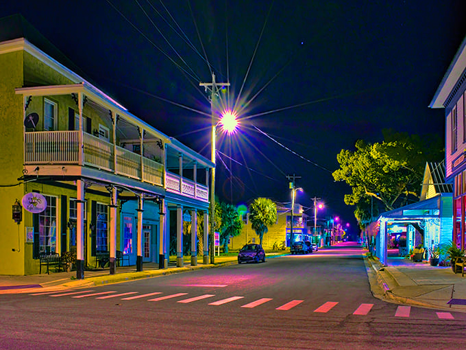 Cedar Key’s buildings glow softly under the night sky, suspended between shadows and starlight—a quiet postcard from Old Florida.