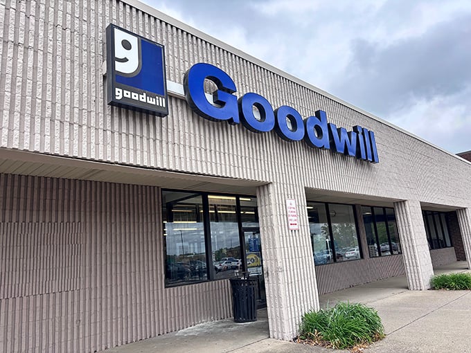 The iconic Goodwill smile logo: universal symbol for "Your wallet can relax now." Hermitage brings the goods!