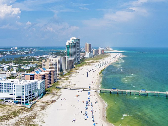 Gulf Shores' pristine beaches and azure waters offer Caribbean views at Alabama prices—who needs Cancun when paradise is this affordable?