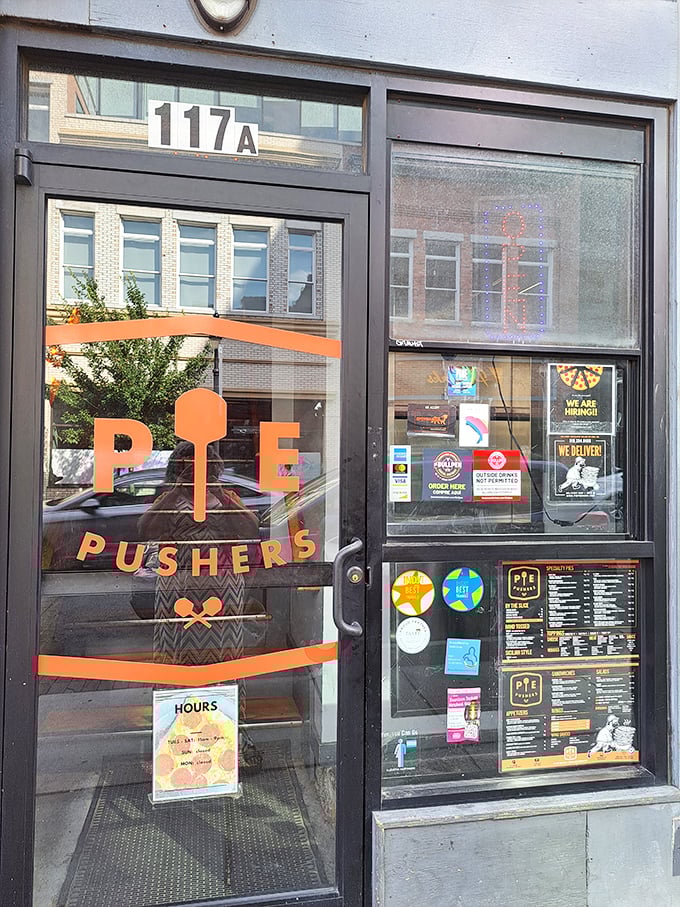 Pie Pushers' blue building with its funky orange logo stands out like that cool friend who always knows the best food spots.