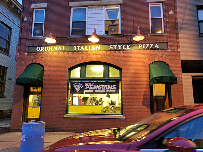"Original Italian Style Pizza" isn't just a sign – it's a promise that Police Station Pizza has kept for generations of Ambridge residents.