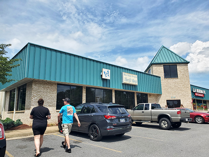 Two shoppers heading in means good finds are waiting - follow the crowd to thrift gold.