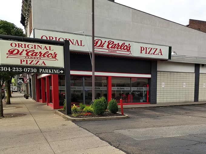 The bold red trim of DiCarlo's announces itself without apology – this is pizza with history, served with West Virginia pride.