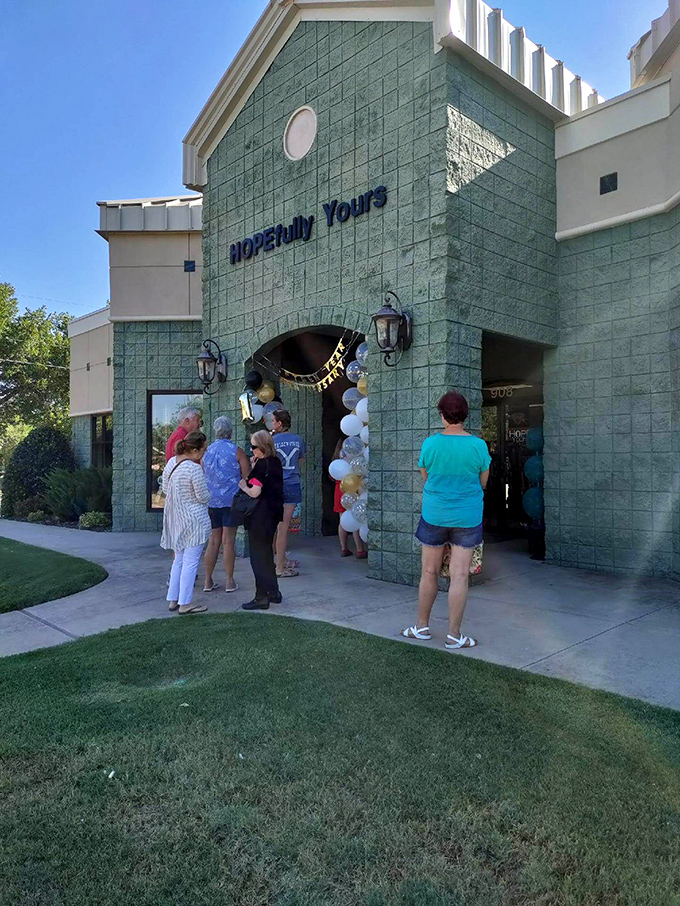 Shoppers gather outside HOPEfully Yours' distinctive entrance. That mint-green facade is like the wrapping paper on a surprise gift.