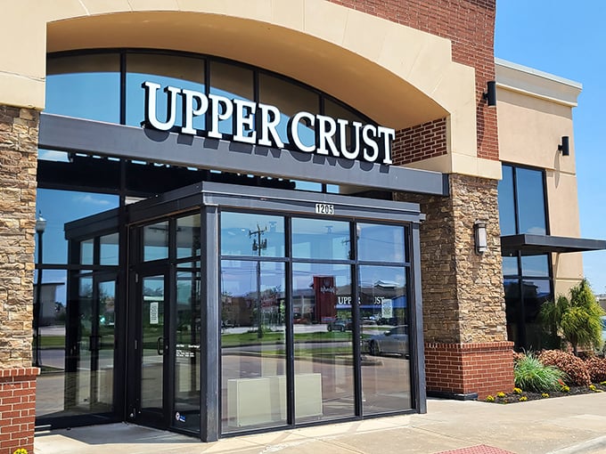 Clean lines and natural stone welcome you to Upper Crust. The entrance promises a pizza experience that's both elevated and down-to-earth.