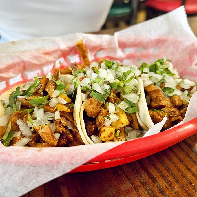 These tacos don't need Instagram filters—the vibrant colors of al pastor, onions, and cilantro create food photography that tastes as good as it looks.