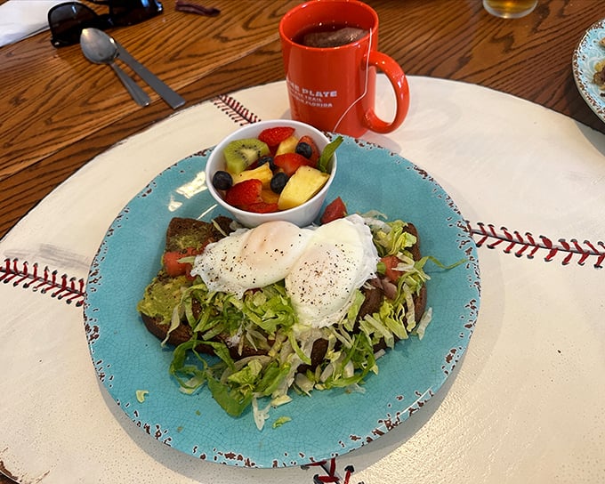 Outdoor dining with eggs that sunny should require sunglasses. The home fries look like they've been introduced to heat by someone who understands commitment. 