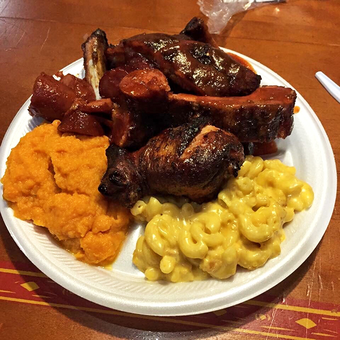 BBQ nirvana on a plate—ribs with that perfect bark, mac and cheese that's actually cheesy, and sweet potato mash that grandma would approve of.