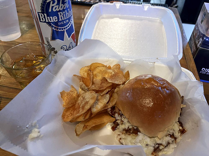 A proper PBR alongside a sandwich that's clearly been crafted with care – proof that unpretentious doesn't mean unimpressive.