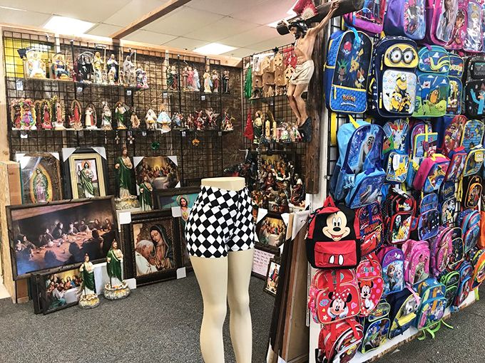 Where fashion meets function—mannequins showcase new clothing alongside colorful backpacks. One stop shopping for back-to-school or just-because-it's-Tuesday purchases.