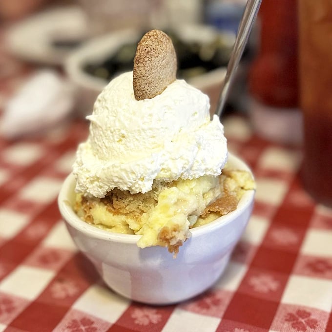 Banana pudding crowned with a cloud of meringue—proof that angels work in The Loveless kitchen. This dessert doesn't just end meals; it creates memories.