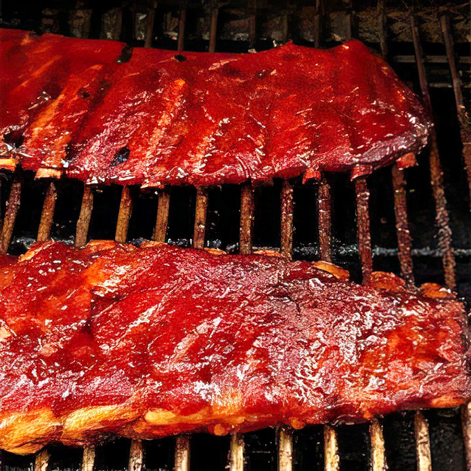 These ribs aren't just cooked – they're serenaded into tenderness. That glossy, caramelized sauce is the kind of thing food dreams are made of.