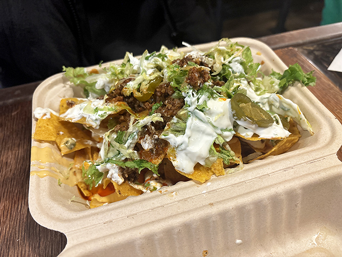 The holy trinity of Mexican street food: seasoned beef, melted cheese, and fresh toppings on a foundation of perfectly crisp tortilla chips.