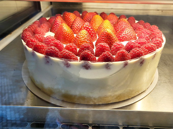 Berry cheesecake that's dressed for success. Those perfectly arranged raspberries and strawberries aren't just showing off—they're proving that sometimes beauty really isn't skin deep.