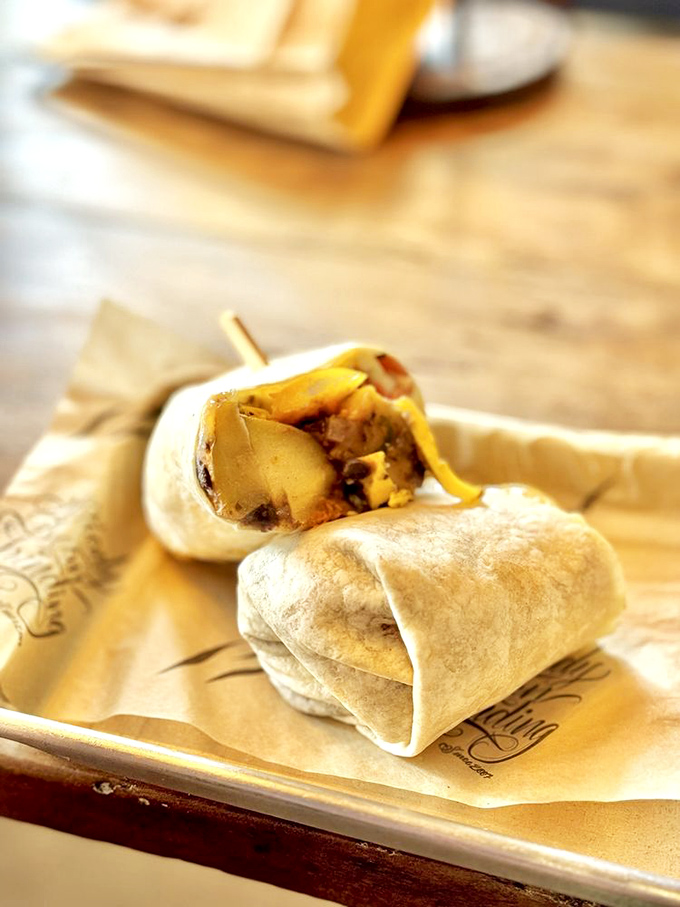 This breakfast burrito doesn't just start your day—it launches it into orbit with eggs and veggies peeking out like they know something you don't.