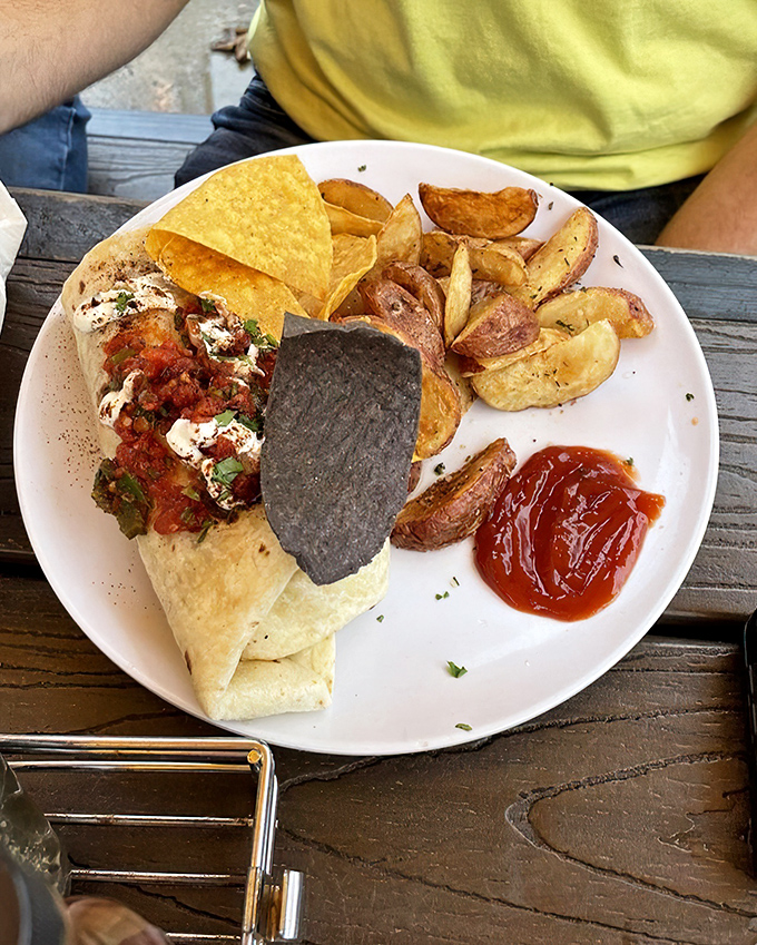 Breakfast burritos should always look this good – stuffed to bursting, served with crispy potatoes, and demanding to be photographed before devoured.