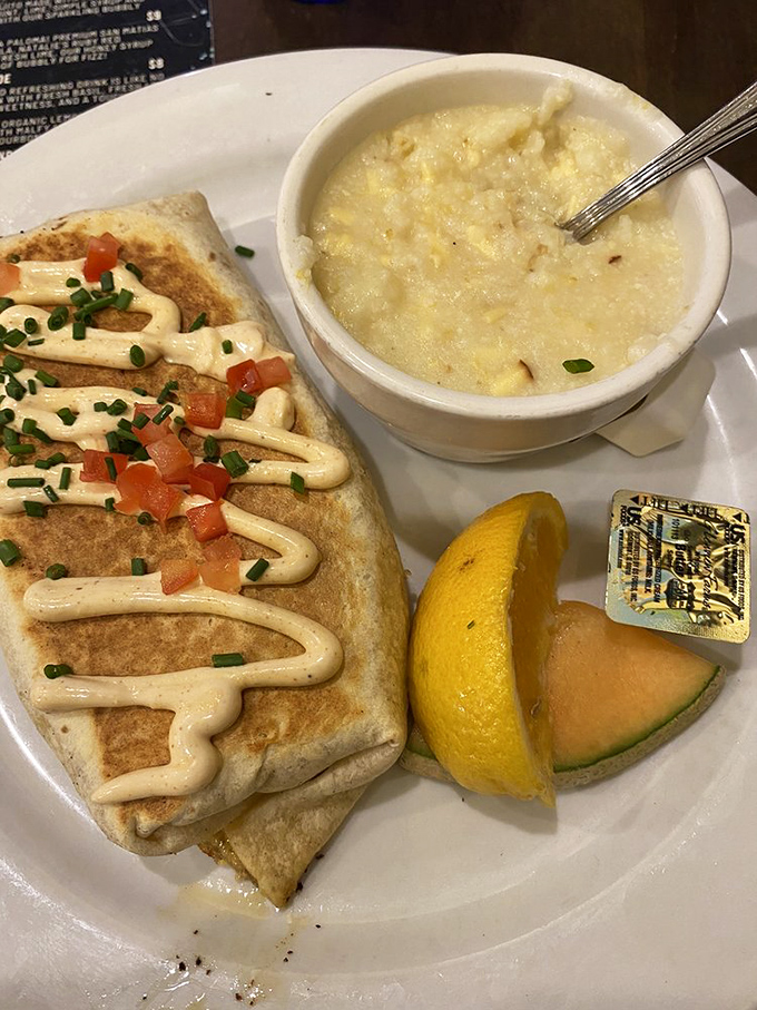 This isn't just a breakfast burrito—it's morning comfort wrapped in a tortilla, with creamy sauce and grits that sing of Southern charm.