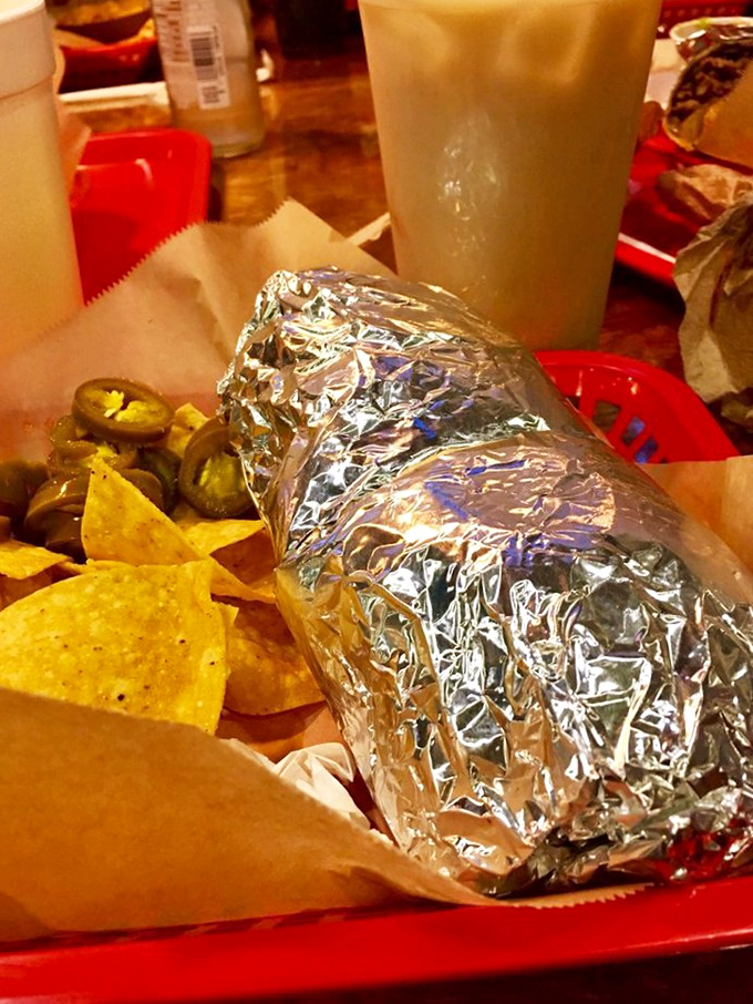 The classic pairing: a silver-wrapped burrito alongside chips and jalapeños. Like Astaire and Rogers, but significantly more satisfying after a long day.