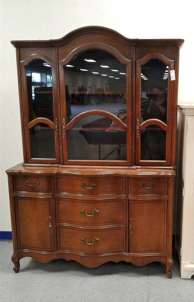 Not your average cabinet – this elegant wood hutch whispers of dinner parties past and family gatherings future. True craftsmanship at outlet prices.