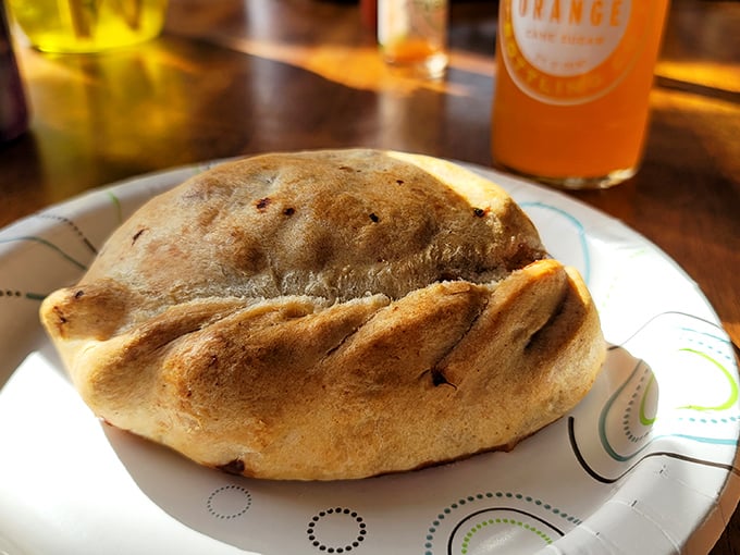 Not quite a calzone, not quite a sandwich—this melty masterpiece defies categorization while demanding immediate consumption.