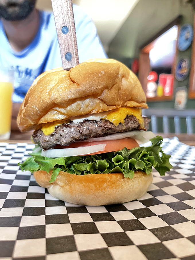 Behold the architecture of joy: perfectly stacked layers of beef, cheese, and fresh veggies on a toasted bun. This isn't fast food—it's slow happiness.