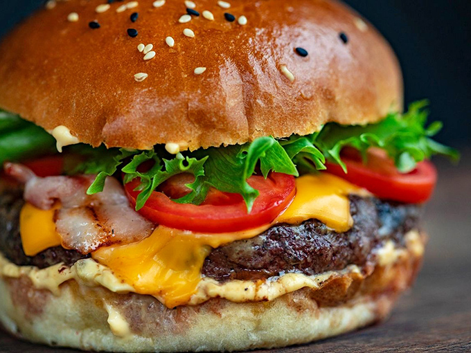 Not just a burger, but a statement of purpose. That melty cheese cascade is what dreams are made of when salads just won't cut it.