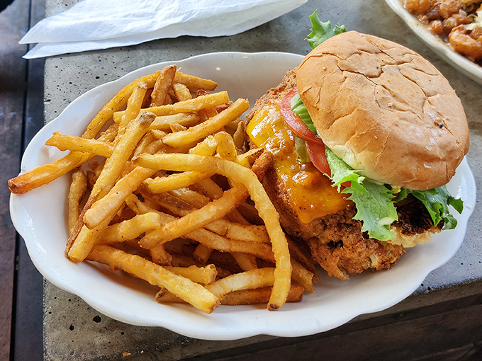 Burger architecture that would make Frank Lloyd Wright proud. Perfectly stacked layers of flavor with fries that deserve their own fan club.