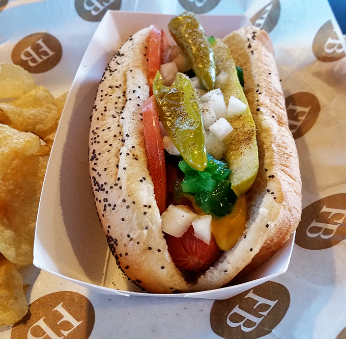 The Chicago dog—a Midwestern masterpiece transplanted to Arkansas soil—dressed with more toppings than a sundae bar at a wedding.
