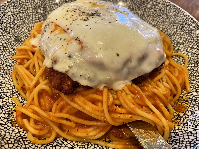 Chicken Parmigiana that doesn't mess around—crispy cutlet, bright marinara, and cheese melted to that perfect Instagram-worthy stretch. Mamma mia!