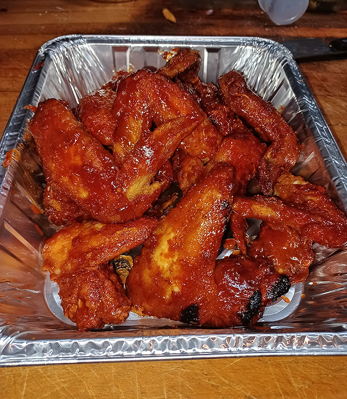 Wings that don't need fancy descriptions or artisanal sauces—just napkins, lots of napkins, and maybe a cold beer on standby.