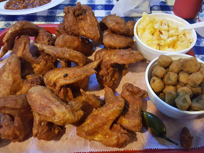 Crispy fried chicken surrounded by mac and cheese and fried okra—a Southern trinity that could convert even the most devoted health food enthusiast.