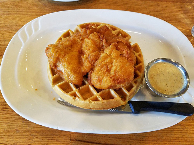 The chicken and waffles don't just share a plate—they've formed a delicious alliance that makes breakfast feel like a celebration.