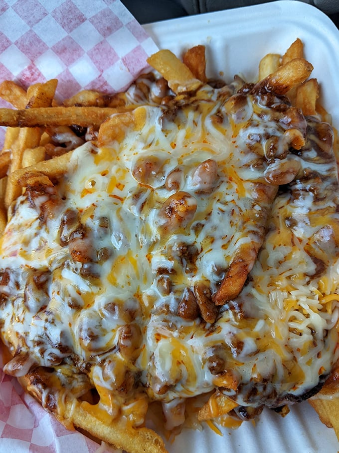 Chili cheese fries that require both a fork and a moment of silent appreciation—a gooey, savory mountain that turns a side dish into the main event. 