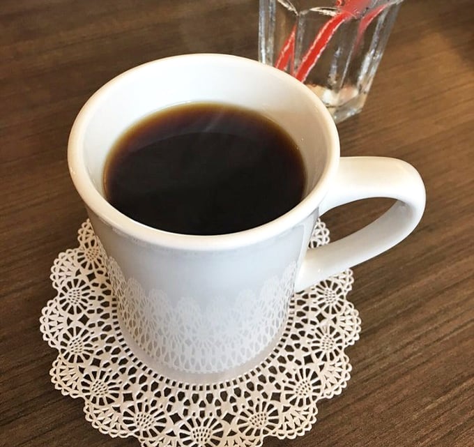 Simple pleasures: strong coffee served on a delicate doily. No fancy pour-overs or barista theatrics—just honest caffeine that knows its job.