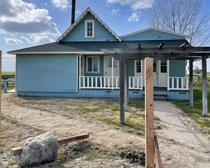 This blue-hued home represents the American dream in its purest form—built by a man who journeyed from slavery to founding a town.