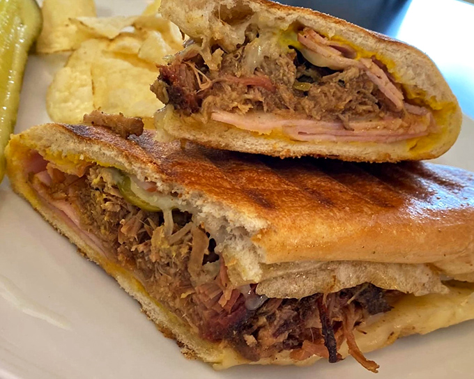 The pressed Cuban—where ham, pork, and cheese meet heat and pressure to create something greater than the sum of its parts. Physics never tasted so good.