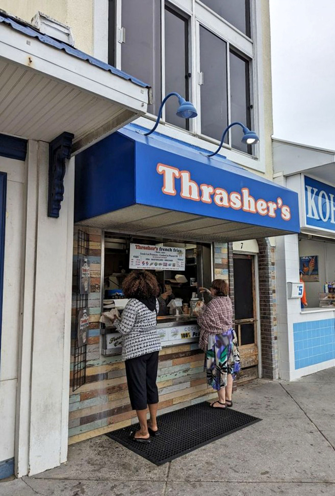 The line at Thrasher's: where strangers become comrades united by a common mission—the pursuit of french fry perfection.