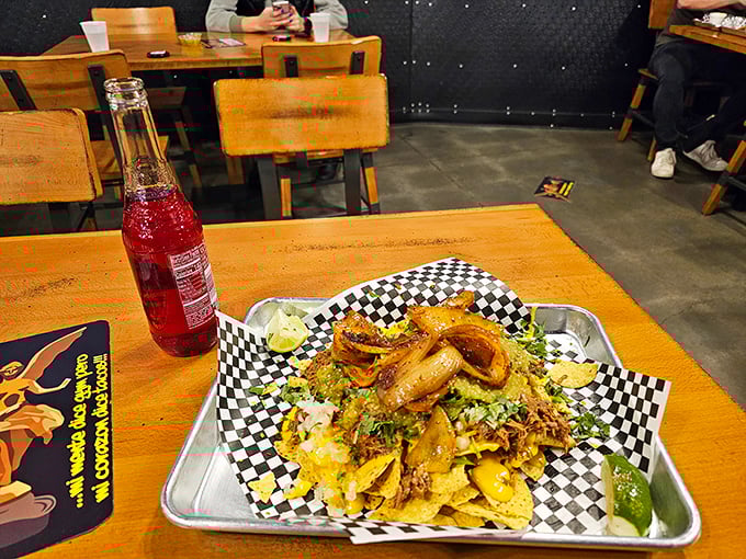 Behold: the nacho mountain that dreams are made of. Those caramelized onions on top aren't just ingredients—they're little flavor bombs of joy.