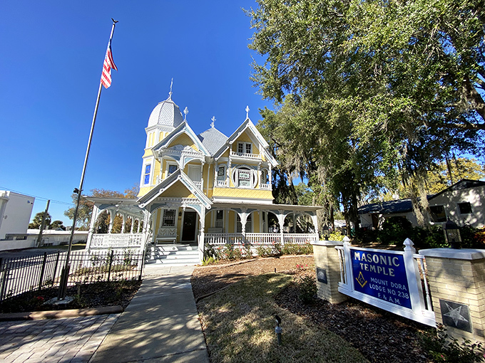The Donnelly House looks like what would happen if a Victorian mansion and a wedding cake had a beautiful baby. That yellow paint job is Florida sunshine in architectural form.