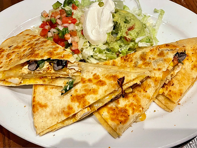 This quesadilla doesn't just stack—it towers with flavor. Melty cheese, perfectly grilled tortillas, and fillings that make sharing an act of true generosity.