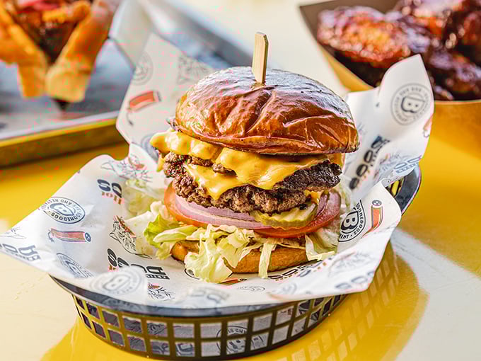 This isn't just a cheeseburger—it's a towering monument to beef perfection, with melty cheese cascading down sides like a yellow waterfall.