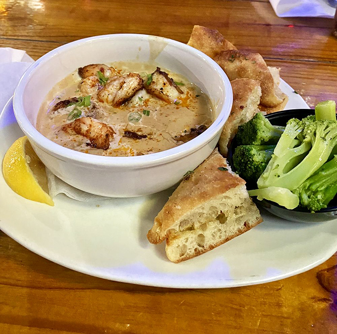 This creamy bowl of Drunken Shrimp is what comfort food dreams are made of—swimming in sauce with bread standing by for rescue missions.