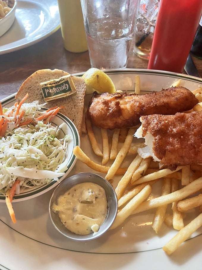 The fish fry – Wisconsin's Friday religion. Crispy, golden perfection with coleslaw that actually deserves to be on the plate, not just color coordination.