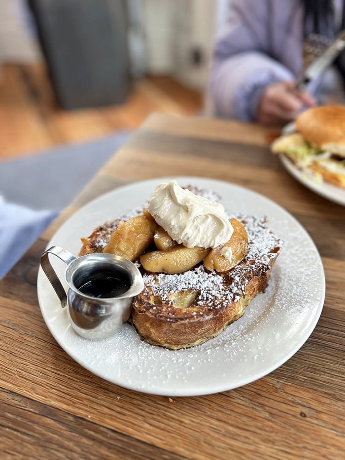 Breakfast artistry on a plate—this isn't just French toast, it's a morning masterpiece with a perfectly runny egg.