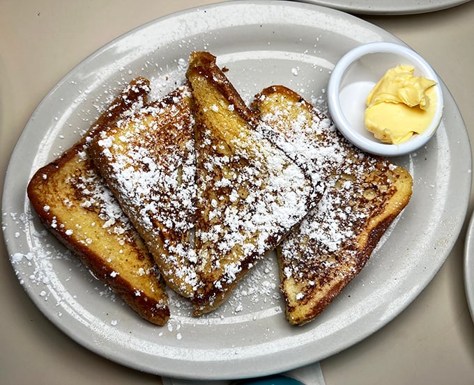 French toast that makes you question all other French toast you've encountered. Dusted with powdered sugar like freshly fallen snow on golden perfection.