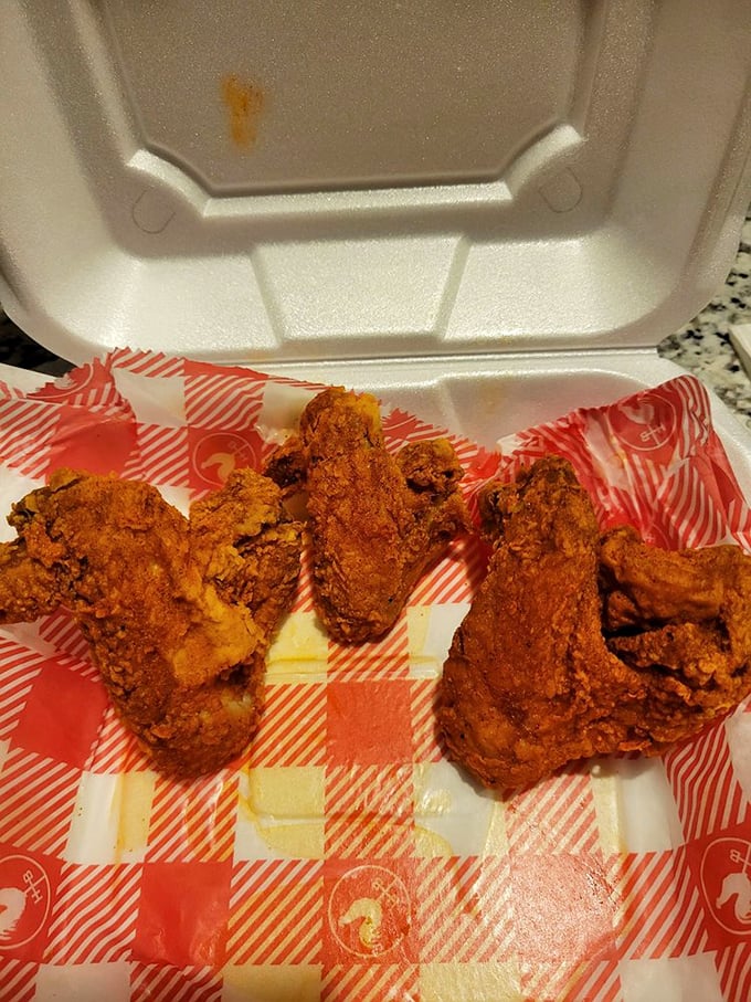 These crimson-coated chicken pieces aren't just fried—they're transformed into crunchy vessels of spice that demand respect.