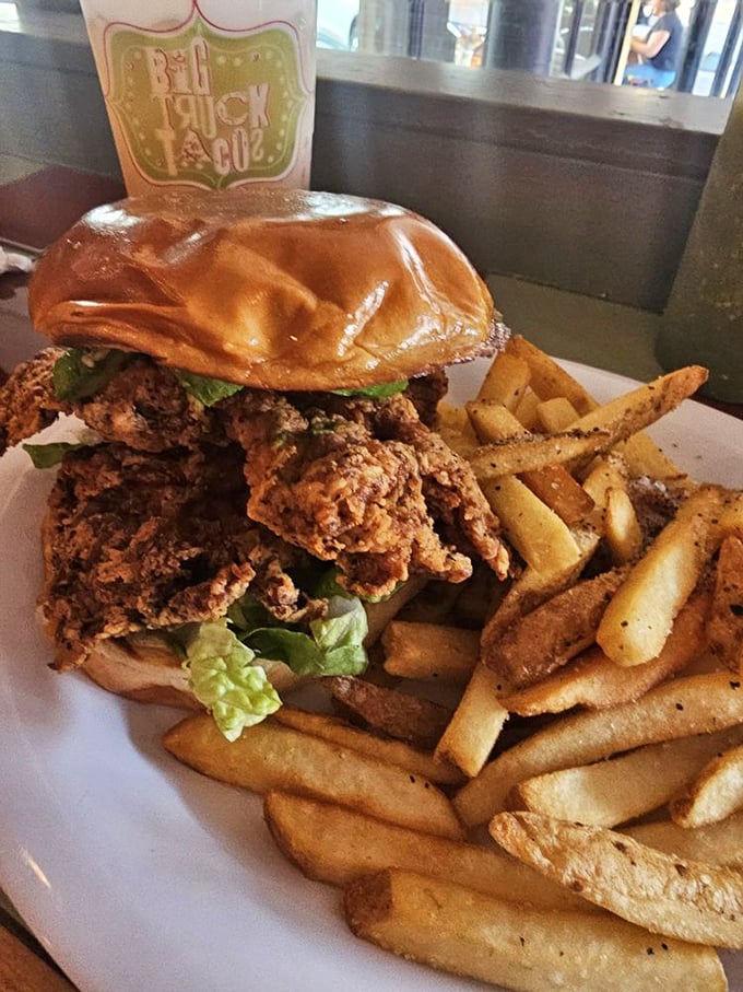 This isn't just a fried chicken sandwich—it's a masterclass in crunch, served with fries that could start their own fan club.
