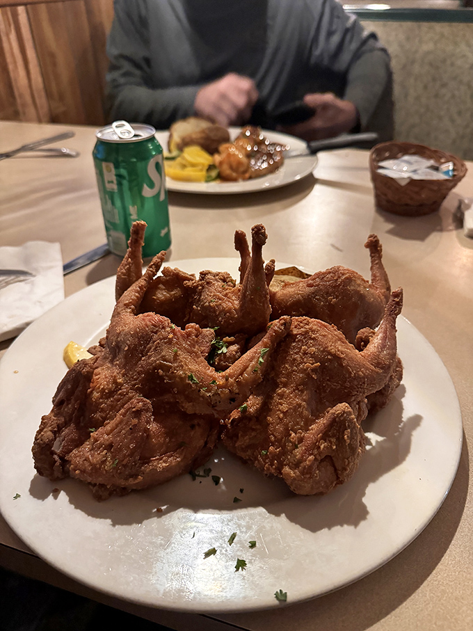 Fried quail that would make Colonel Sanders question his life choices. Crispy, golden, and ready to convince you that small birds mean big flavor.